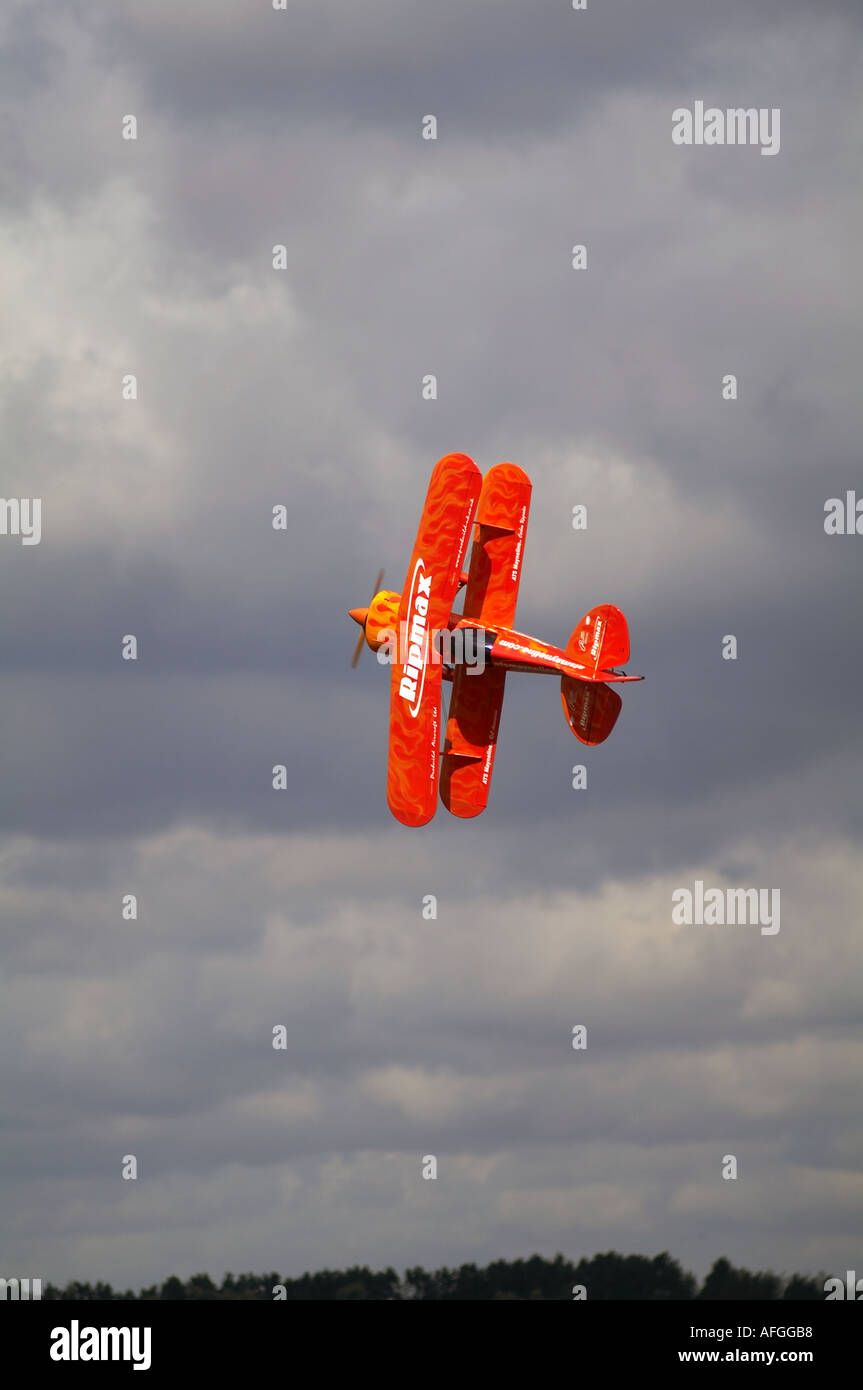 Radio controlled stunt plane performing an aerobatic display loop the ...