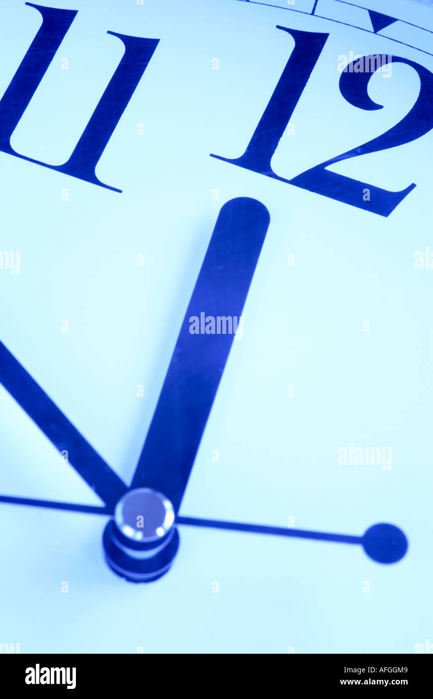 Clock face just before noon Stock Photo - Alamy