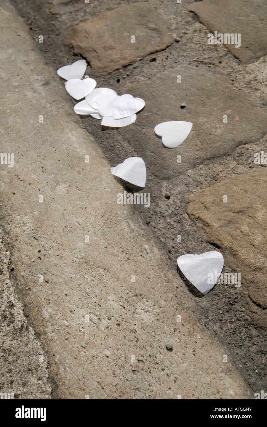 Confetti hearts in gutter, France Stock Photo - Alamy