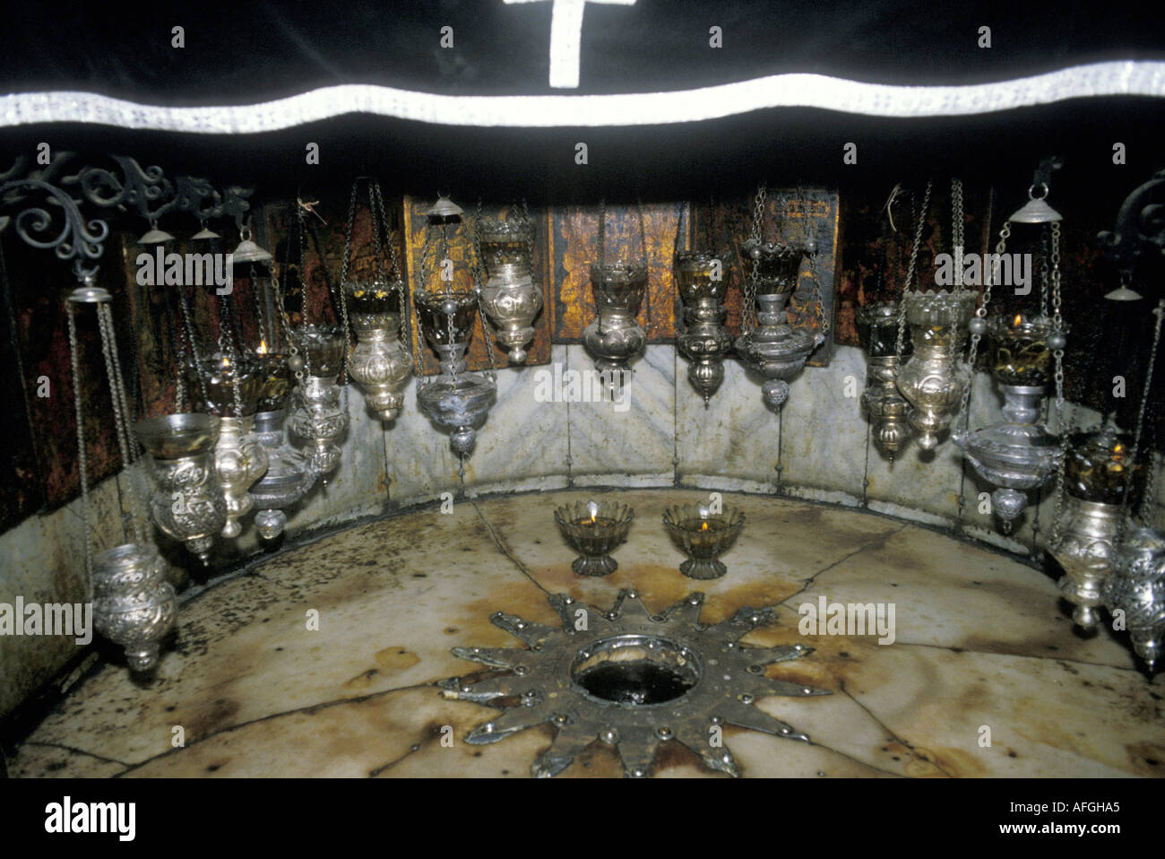 A star in the crypt of the Church of the Nativity in Bethlehem marks ...
