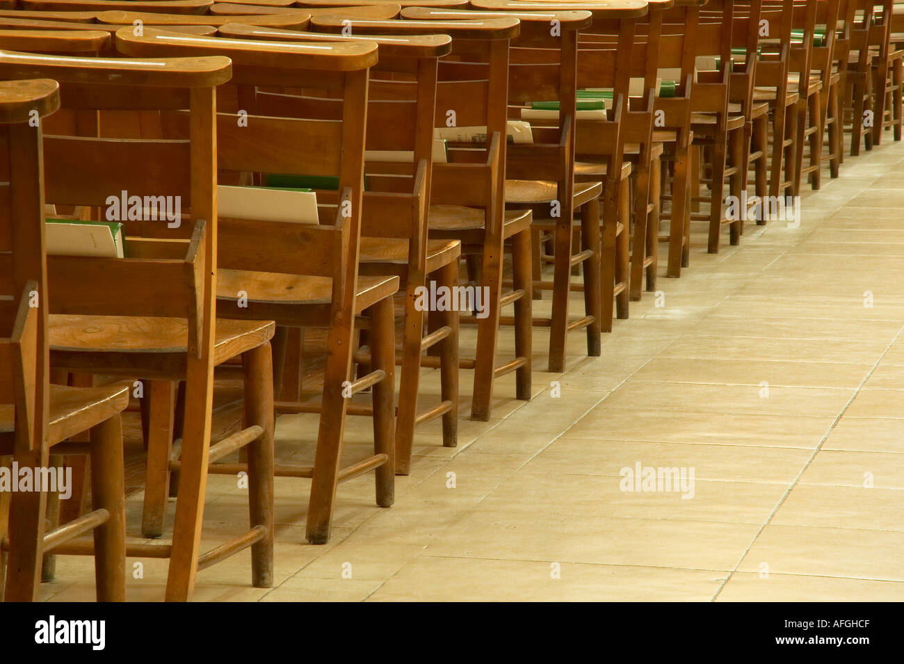 Several rows of empty wooden chairs in an English church Stock Photo ...
