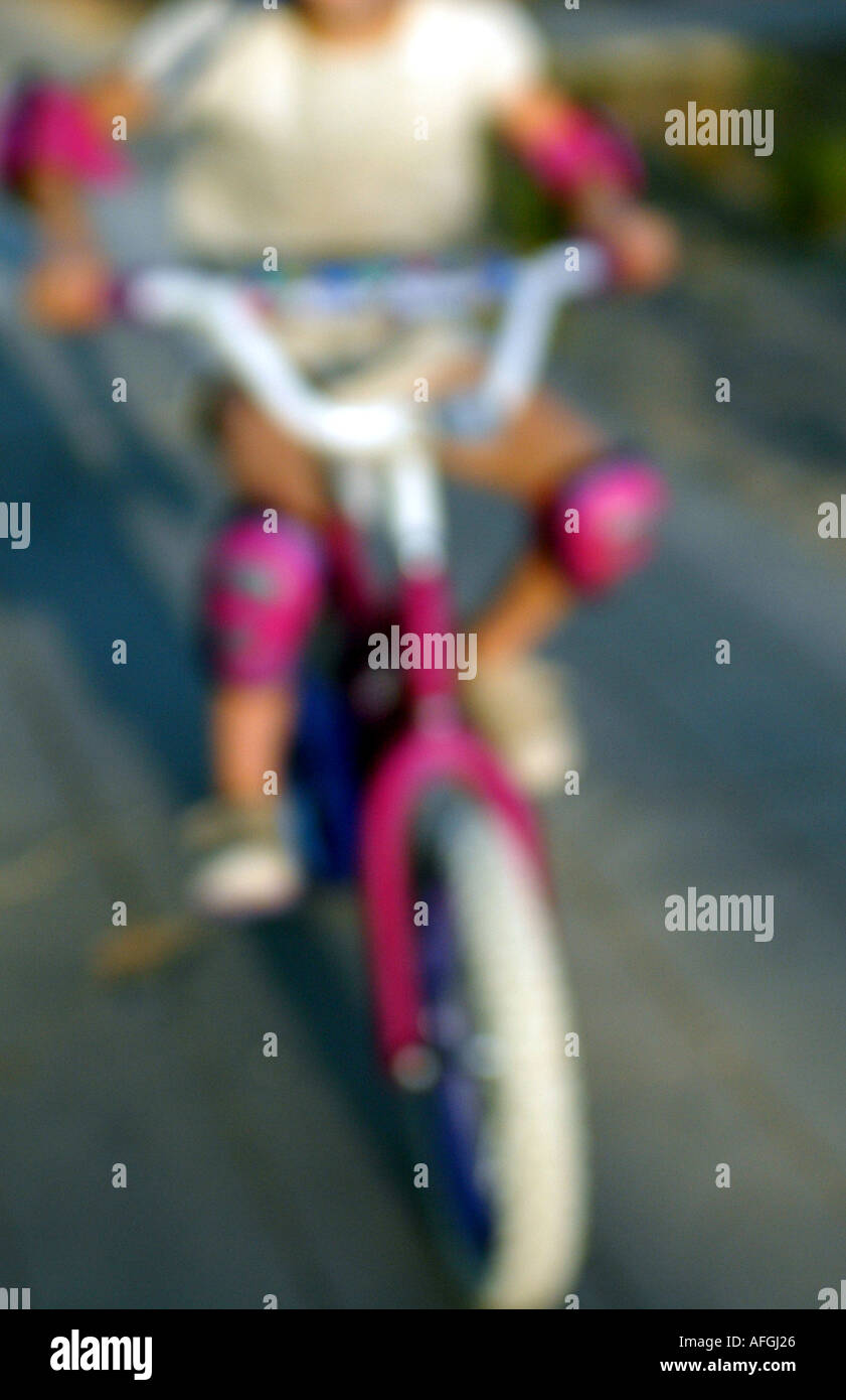 girl learning to ride a bike, portrait Stock Photo - Alamy
