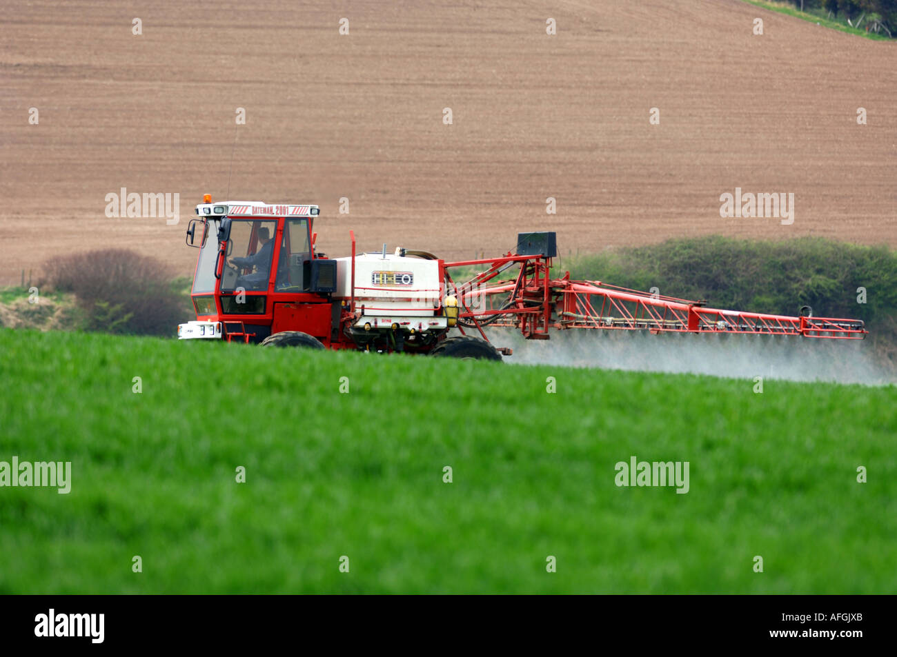 Crop spraying crops spray farm farming tractor, Britain UK Stock Photo ...