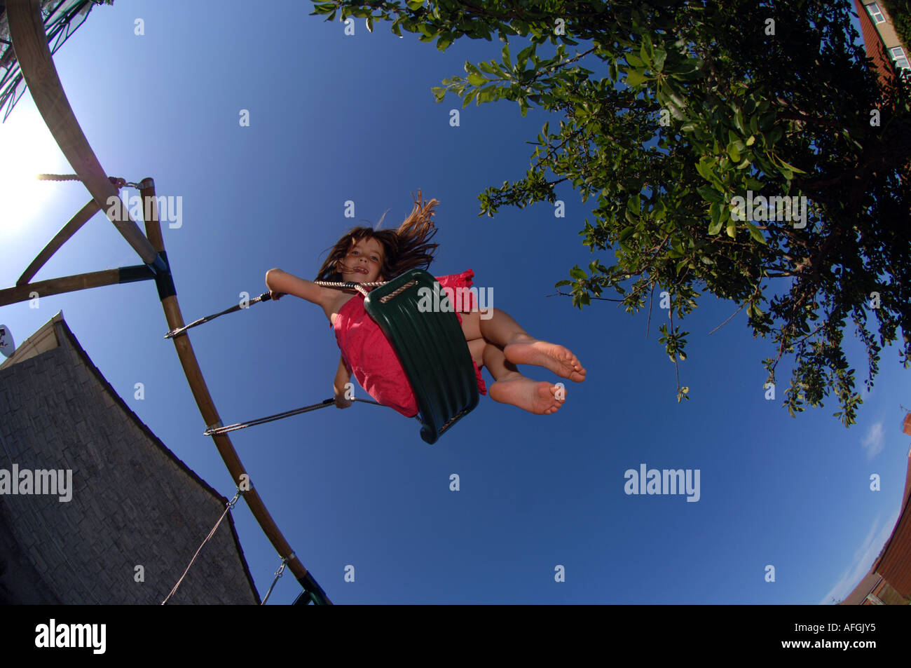Swing, Girl on a swing Stock Photo - Alamy