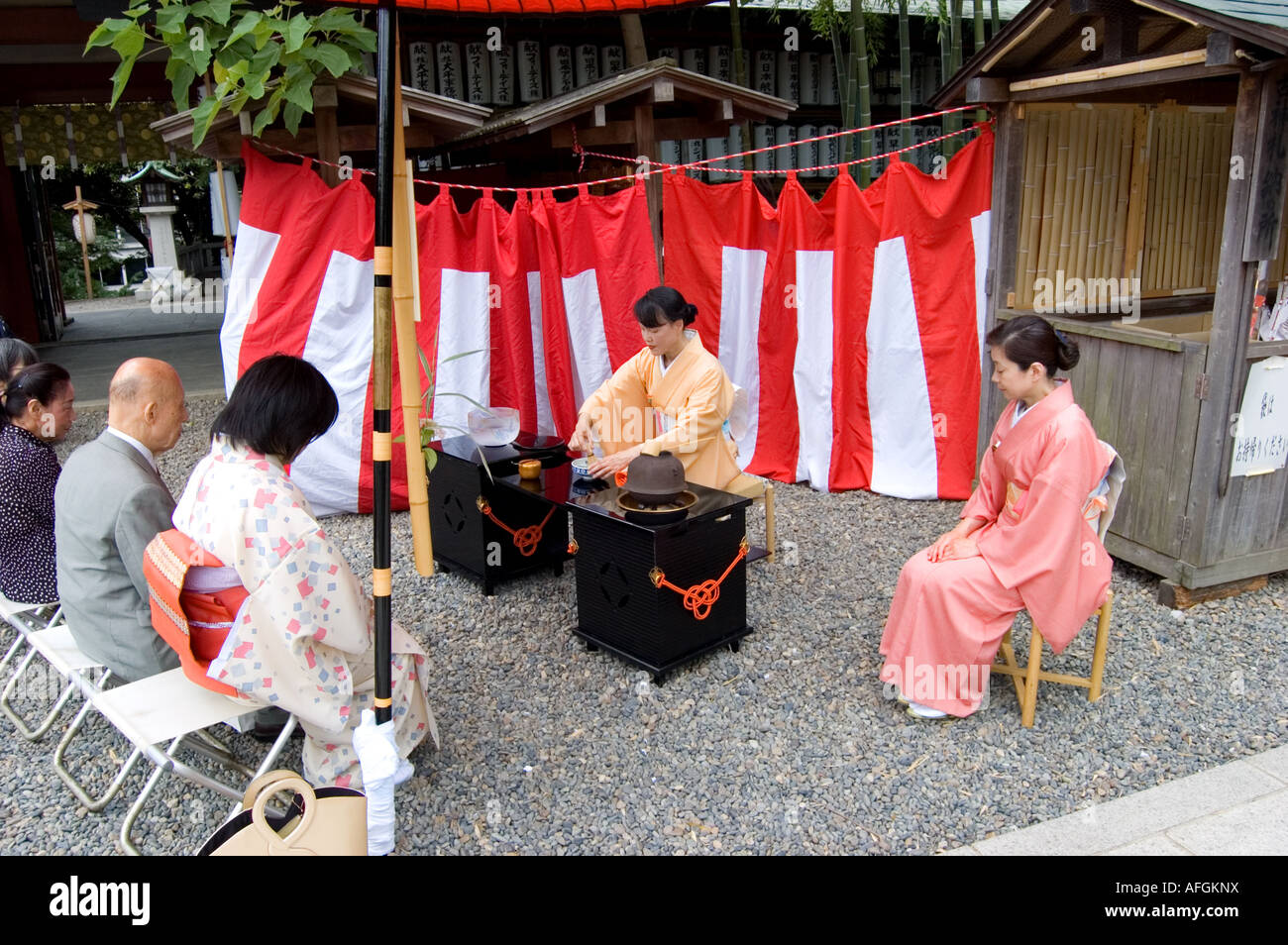 Japanese woman prepares tea during tea ceremony in Shinto Shrine Stock ...