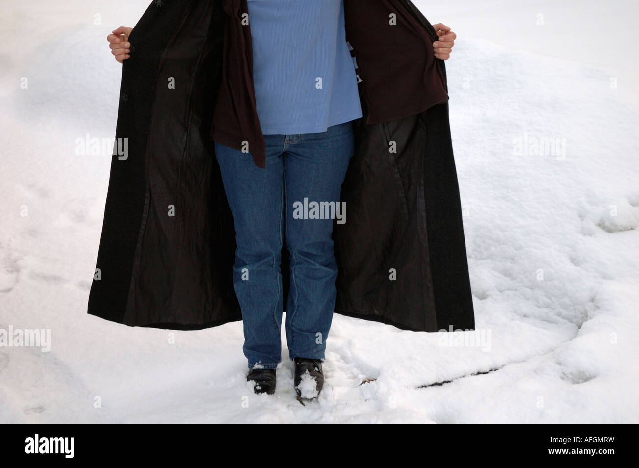 Woman with open coat Stock Photo - Alamy