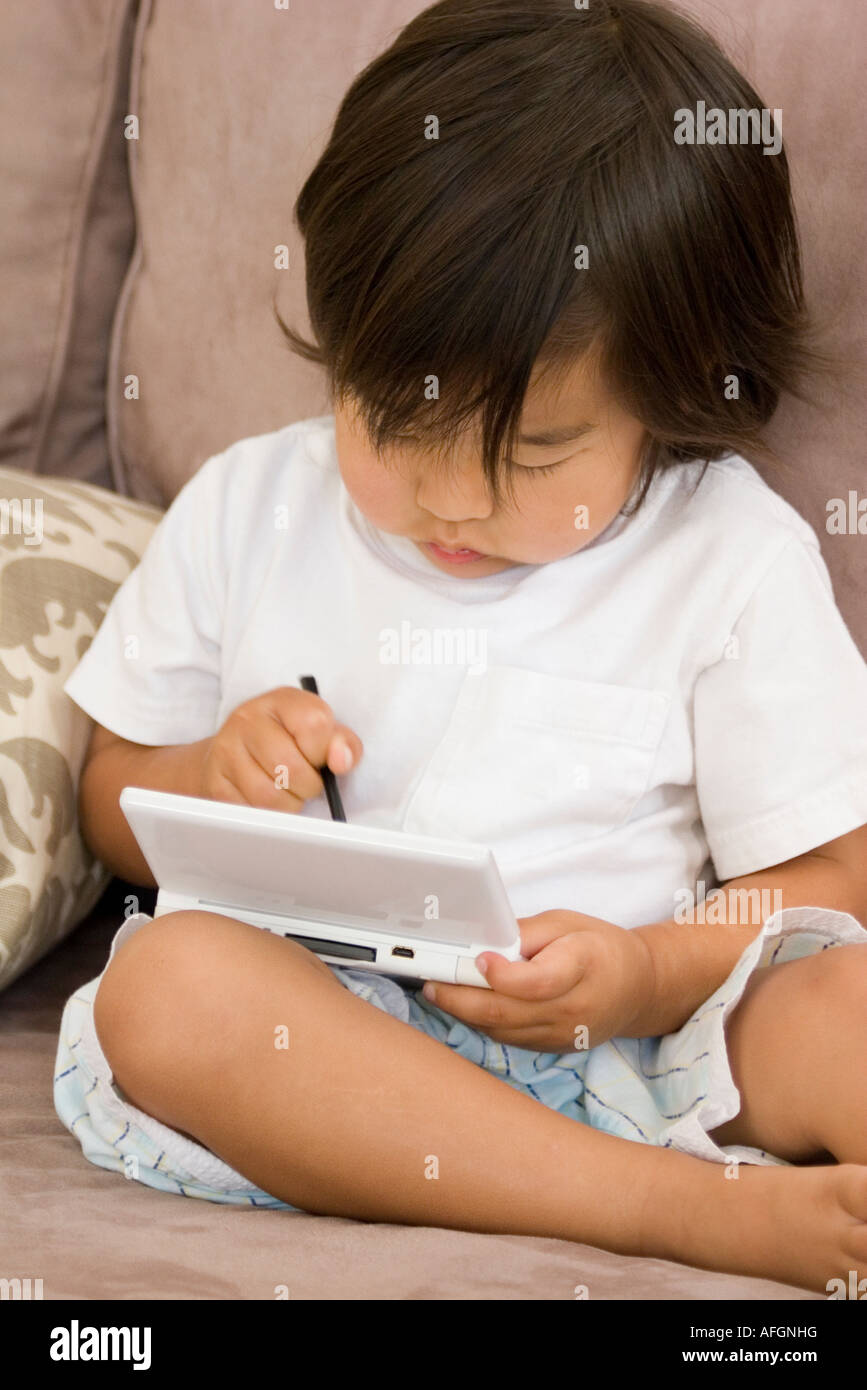 Young Boy Playing Game Stock Photo - Alamy