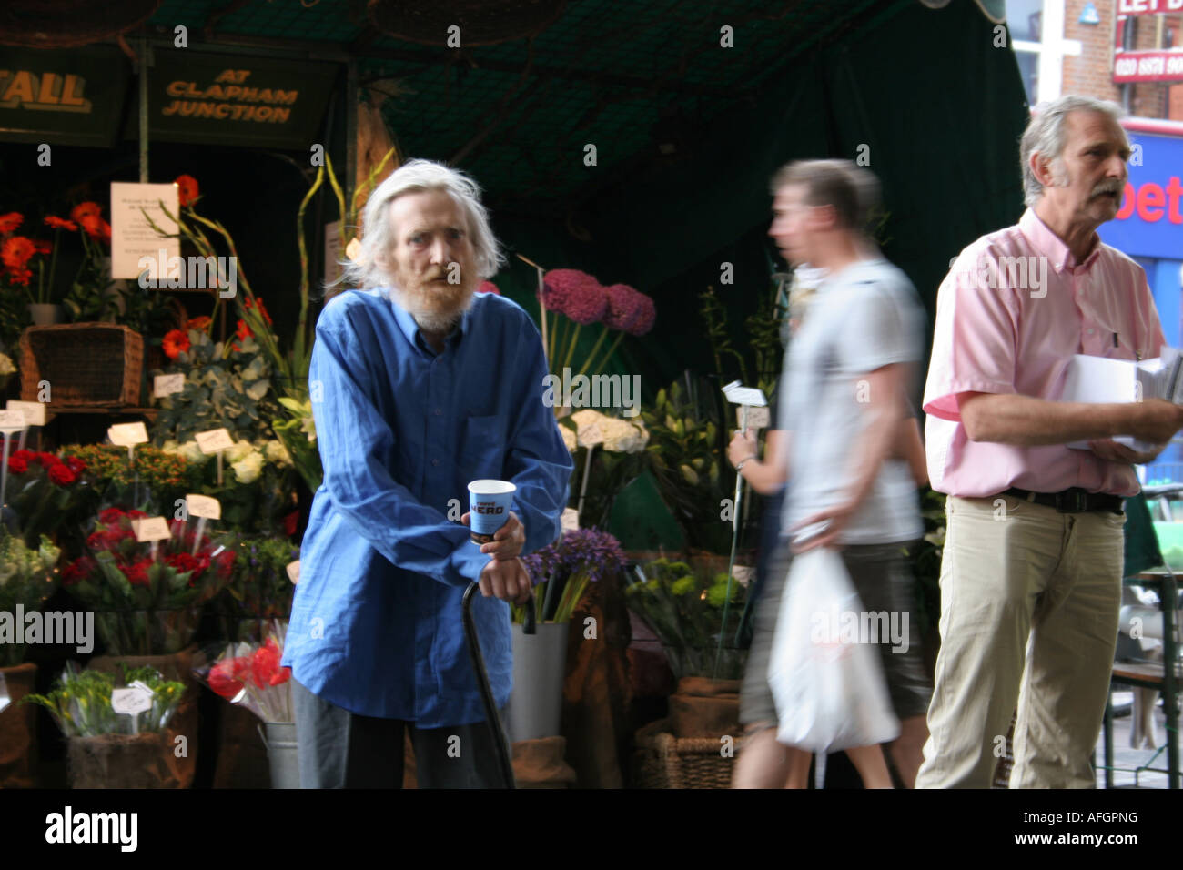 Homeless man begging Stock Photo - Alamy