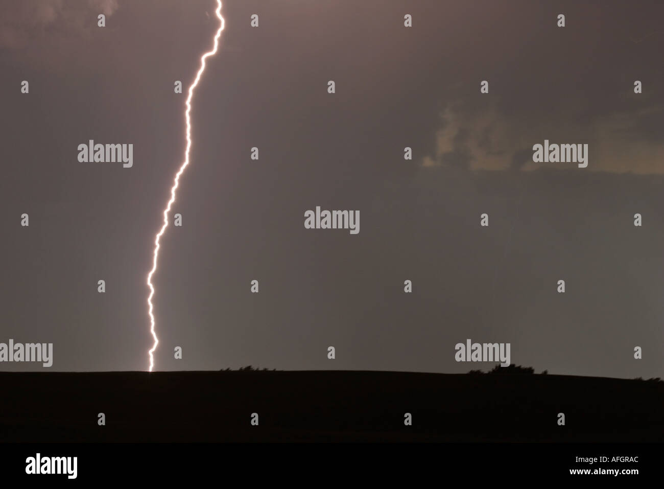 A bolt of lightning photographed during a thunder storm in scenic ...