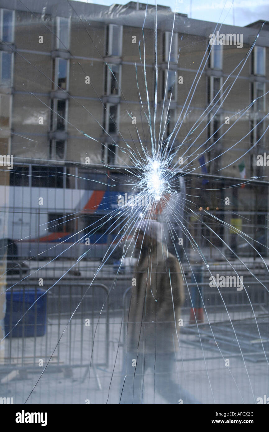 Reflection in window front with cracked glass Stock Photo - Alamy