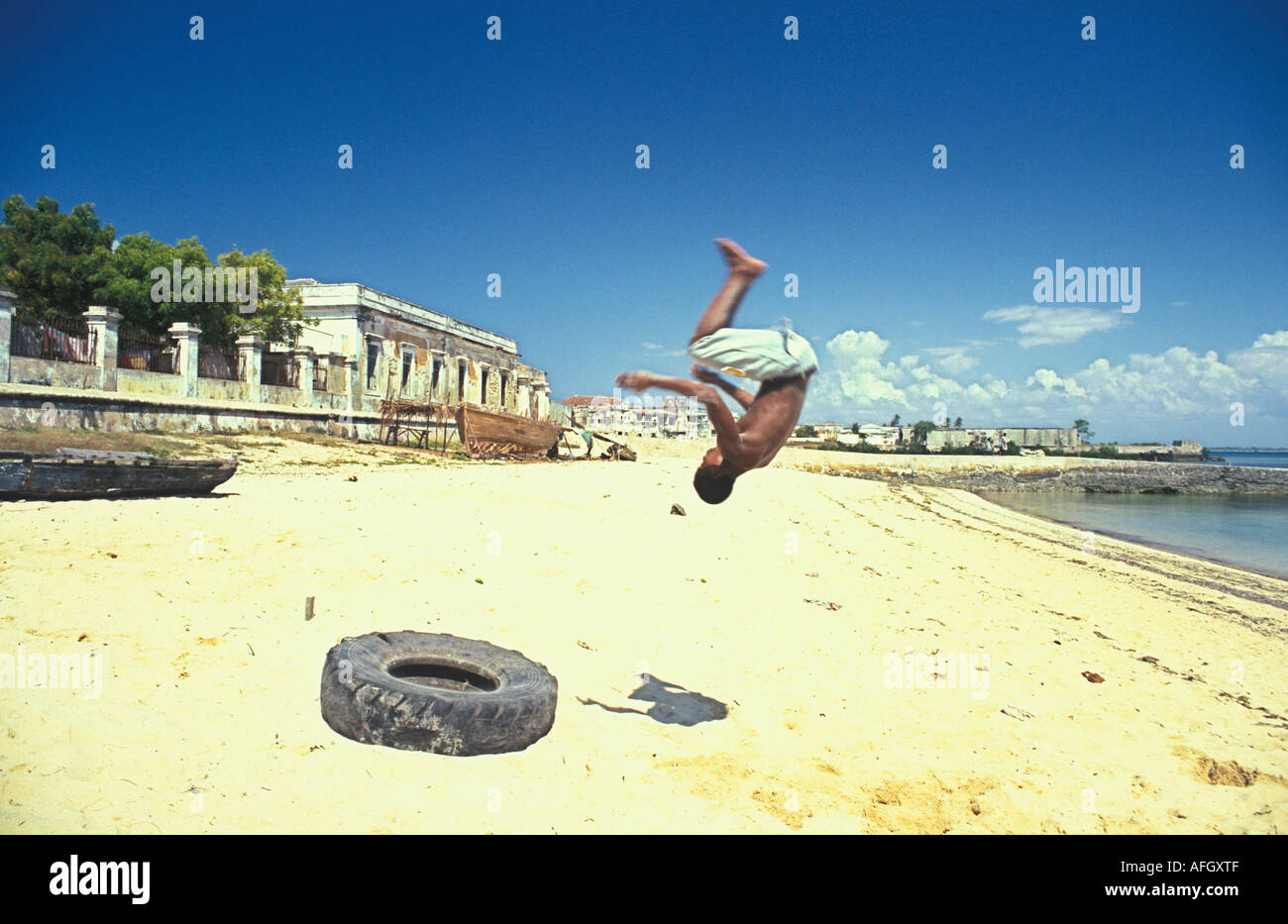Boy making a somersault at the beach Ilha de Moçambique Stock Photo - Alamy