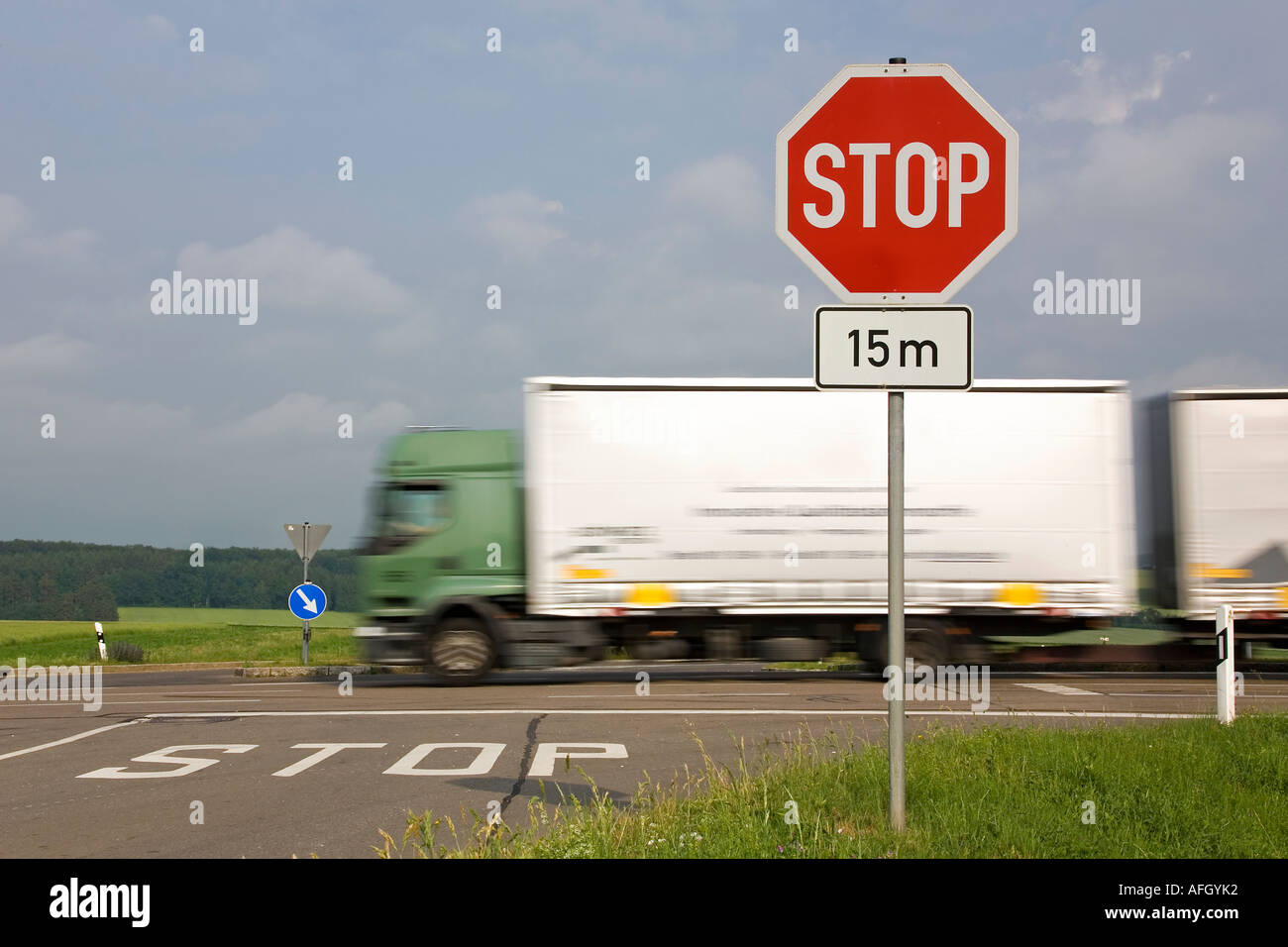 a tractor with semitrailer passes a crossing with a stop sign Stock ...