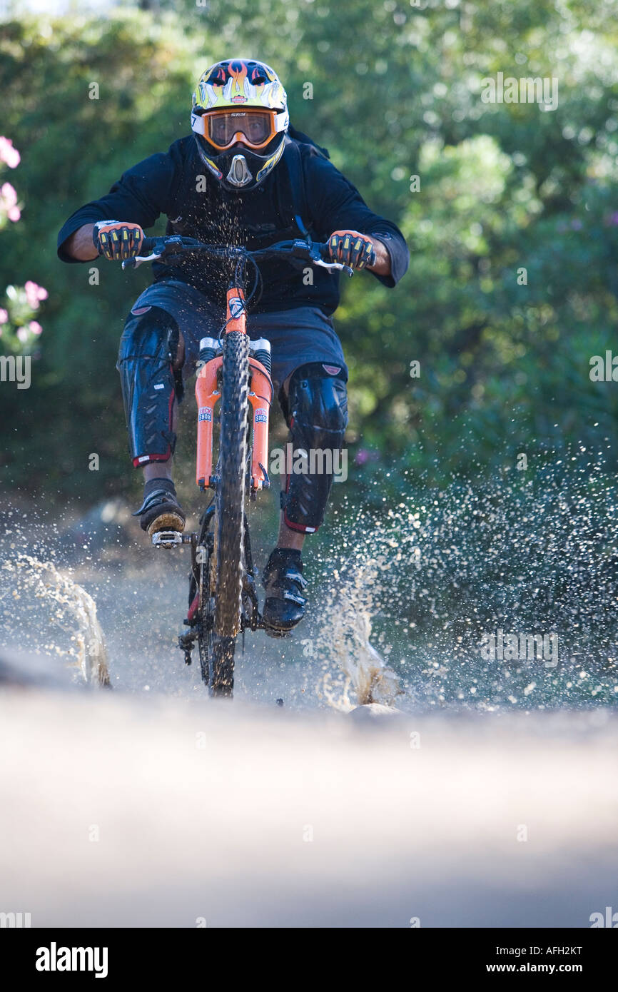 Mountain Biker crossing a stream Stock Photo - Alamy