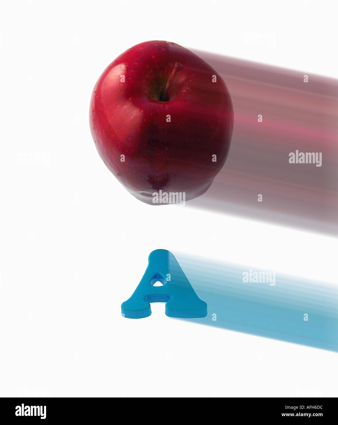 Apple with movement trails and letter A Stock Photo - Alamy