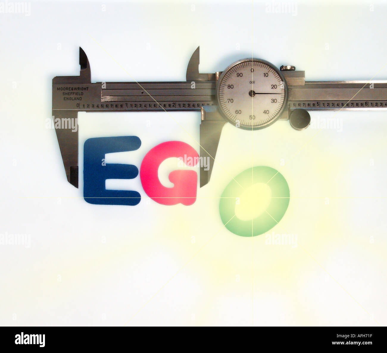 Conceptual image indicating a large ego with sunshine through letter ...