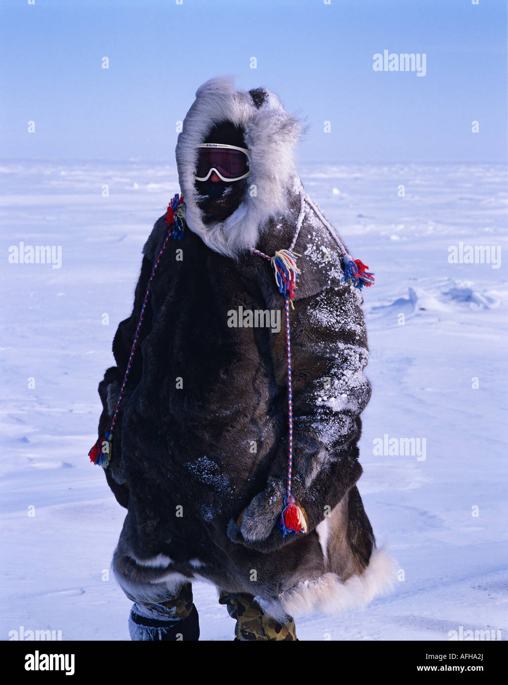 Esquimo walking snow Stock Photo - Alamy