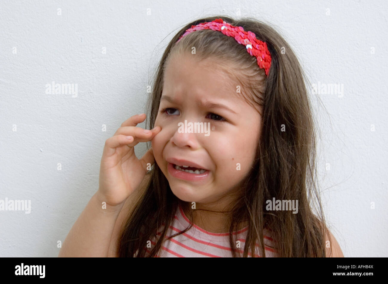 Close-up of a girl crying Stock Photo - Alamy