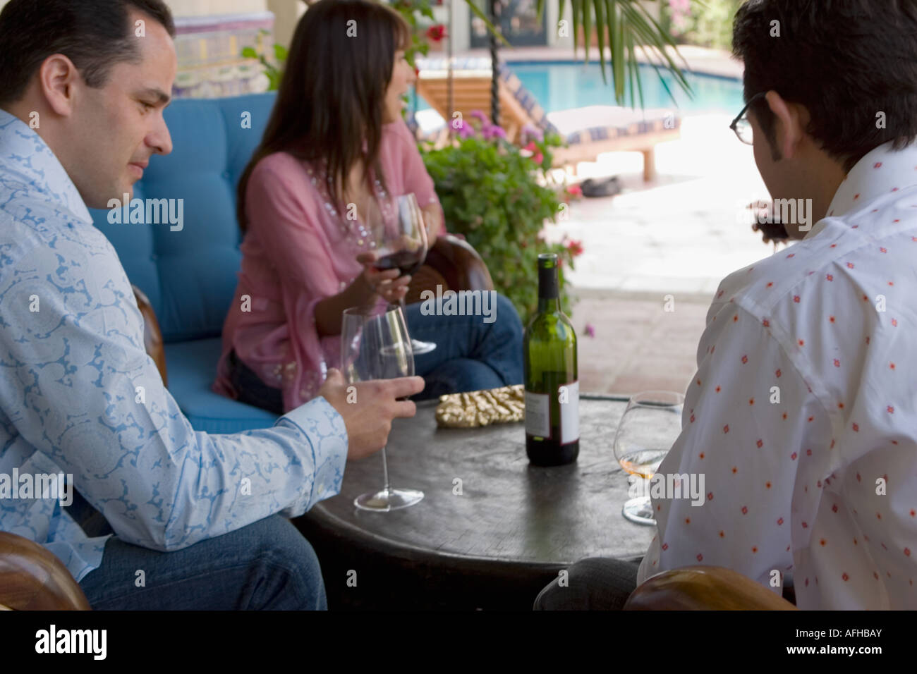 Men socializing swimming pool hi-res stock photography and images - Alamy