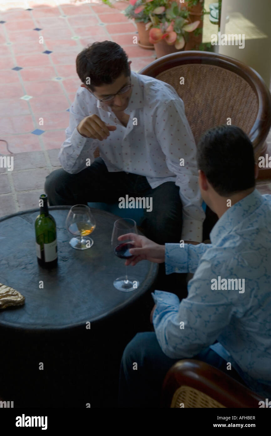 Group of friends socializing outdoors Stock Photo - Alamy