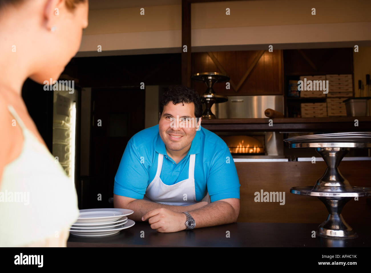Chef interacting with customer Stock Photo - Alamy