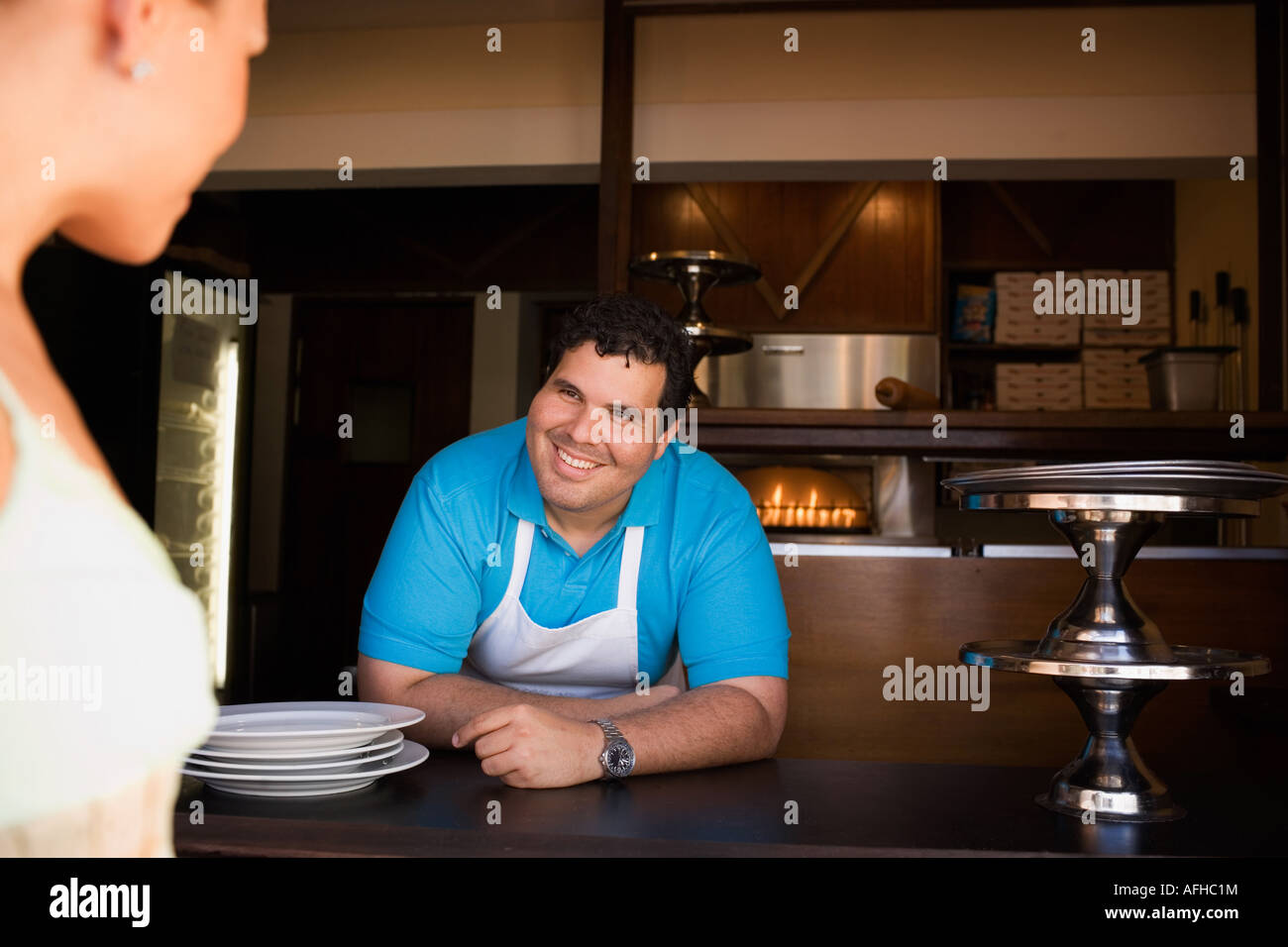 Chef interacting with customer Stock Photo - Alamy