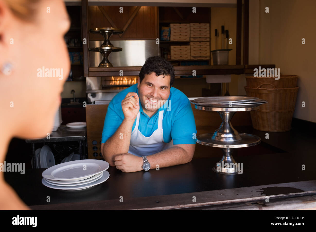 Chef interacting with customer Stock Photo - Alamy