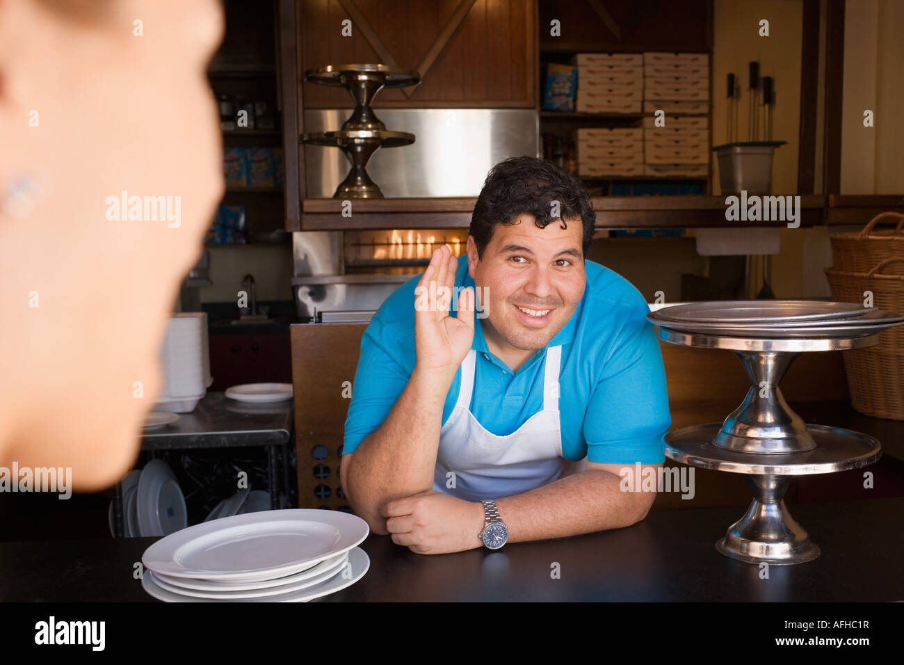 Chef interacting with customer Stock Photo - Alamy