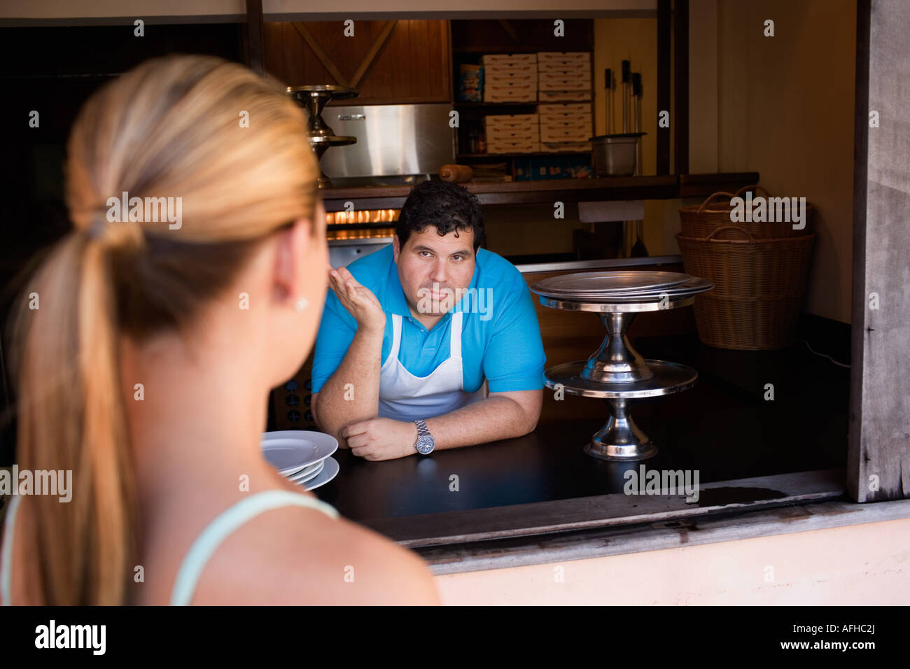 Chef interacting with customer Stock Photo - Alamy