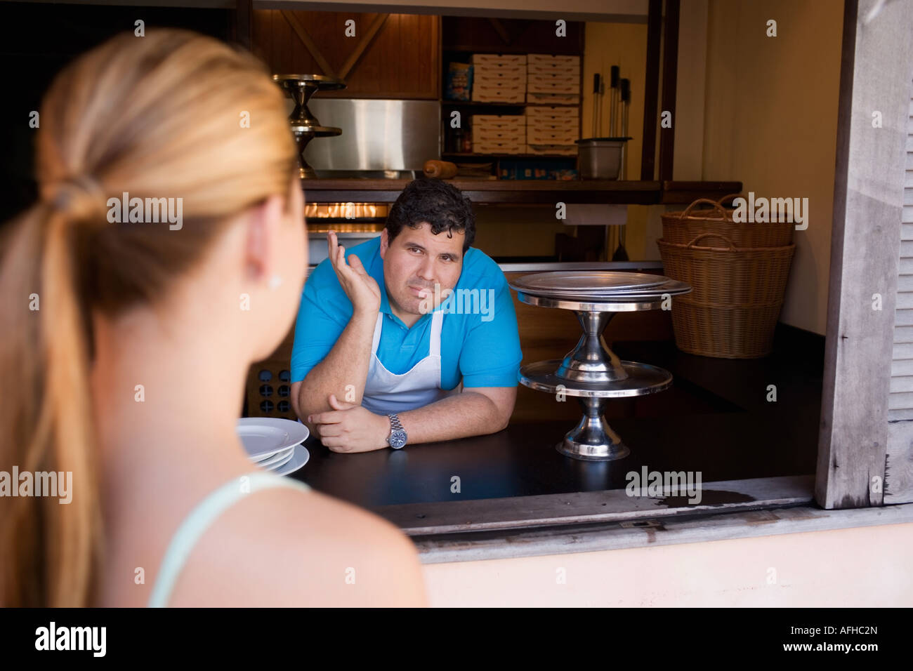Chef interacting with customer Stock Photo - Alamy