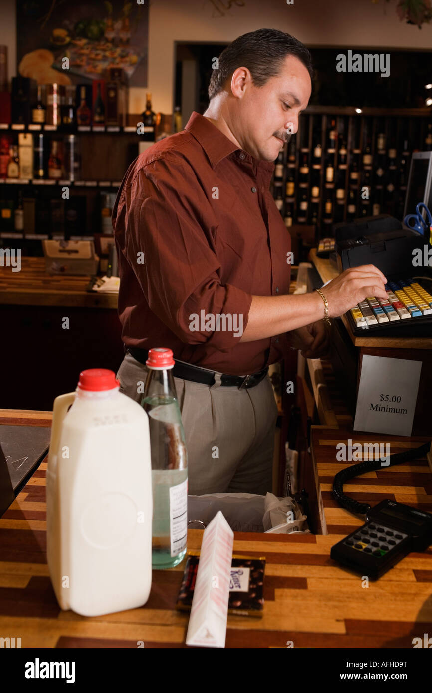 Cashier ringing up groceries hi-res stock photography and images - Alamy