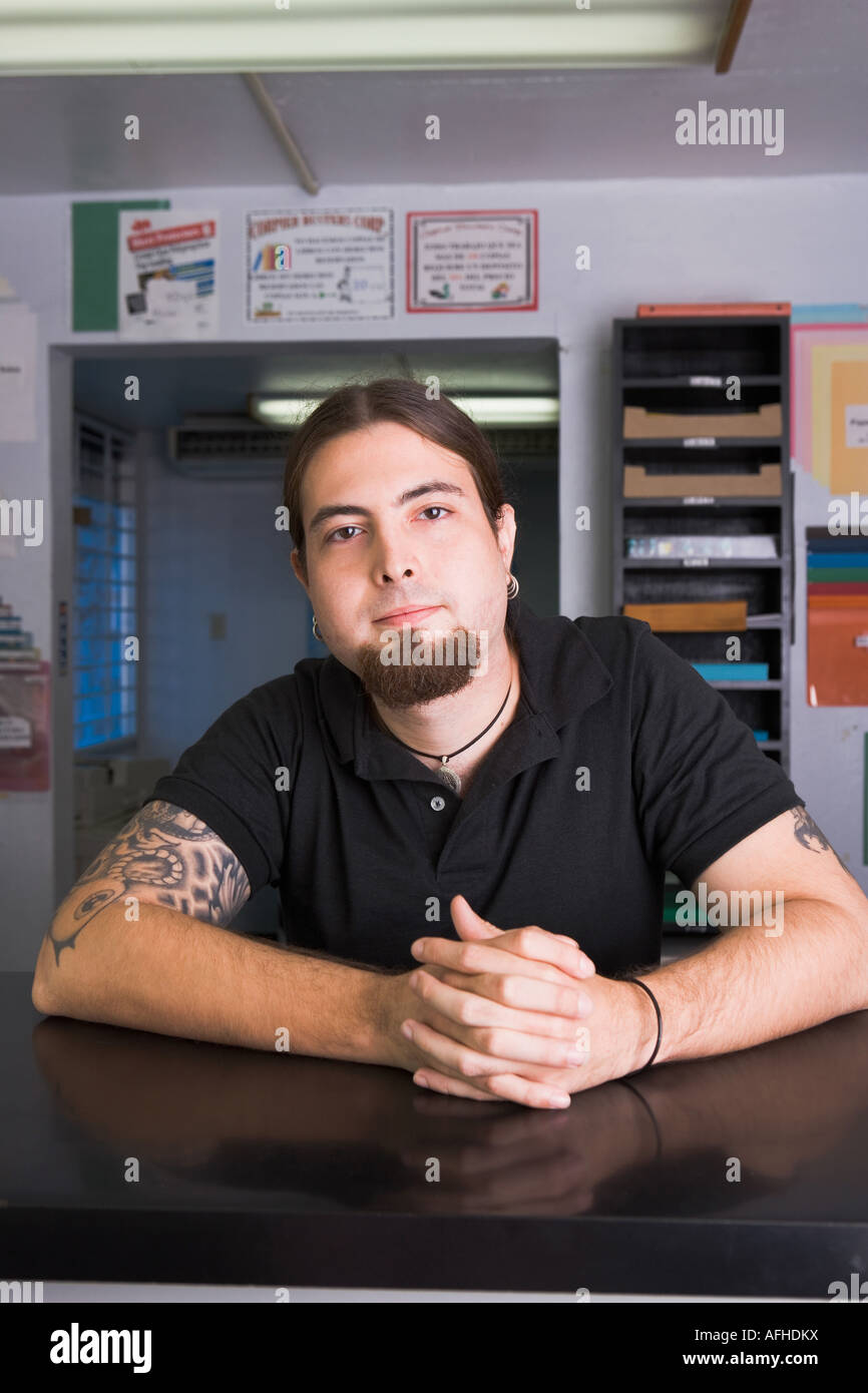 Young man at work in copy center Stock Photo - Alamy