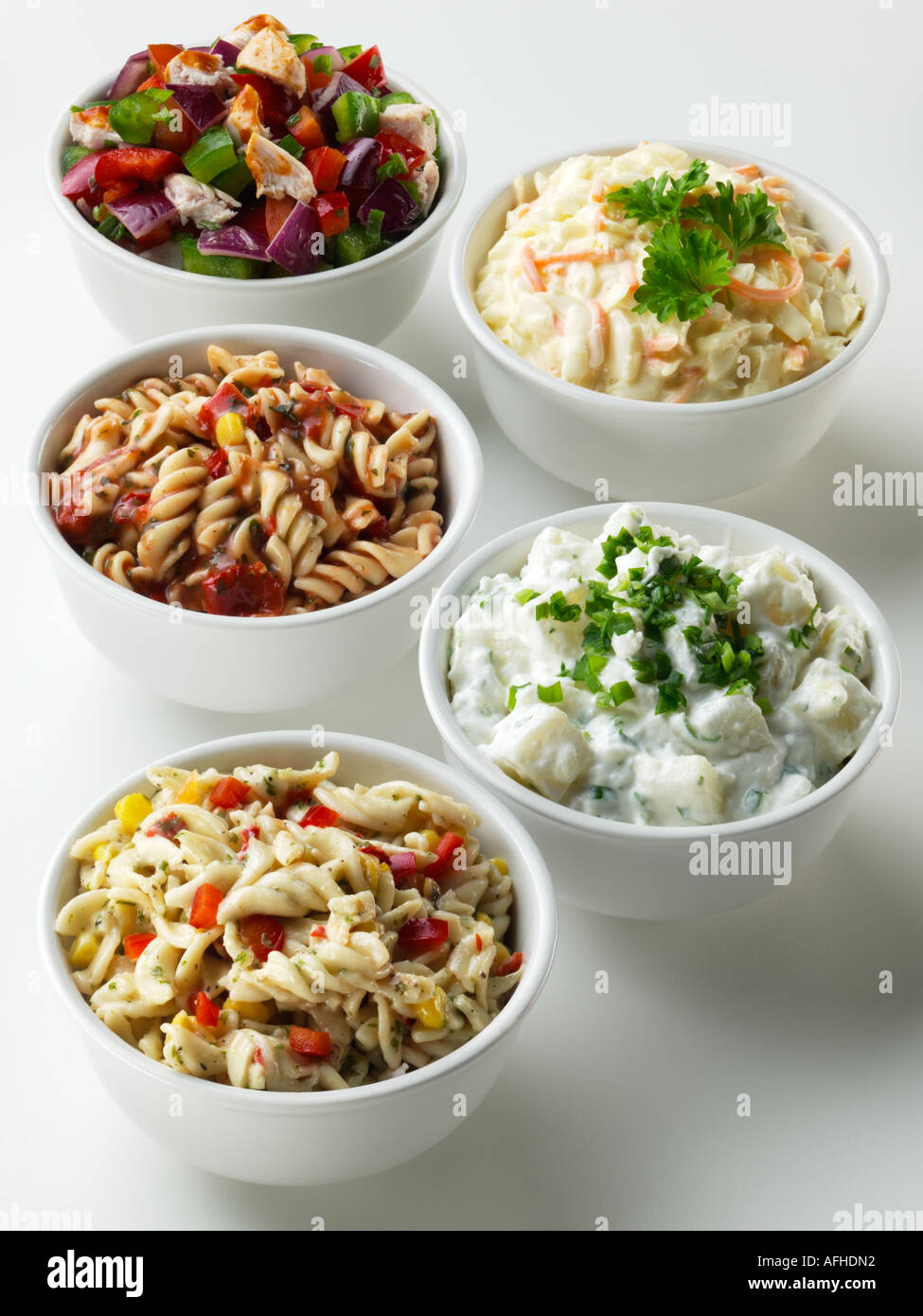five bowls of different salads on a white background Stock Photo - Alamy