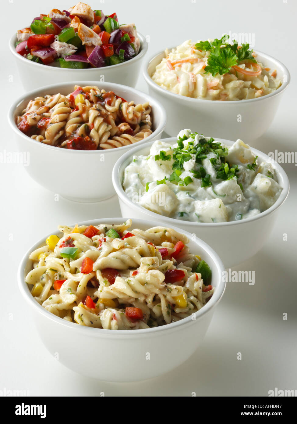 five bowls of different salads on a white background Stock Photo - Alamy