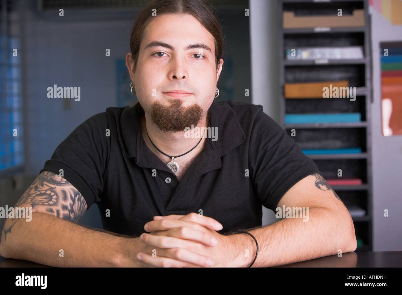 Young man at work in copy center Stock Photo - Alamy