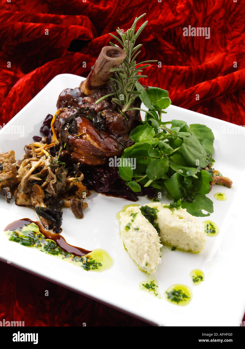 Lamb shank with mashed potato quenelles Stock Photo - Alamy