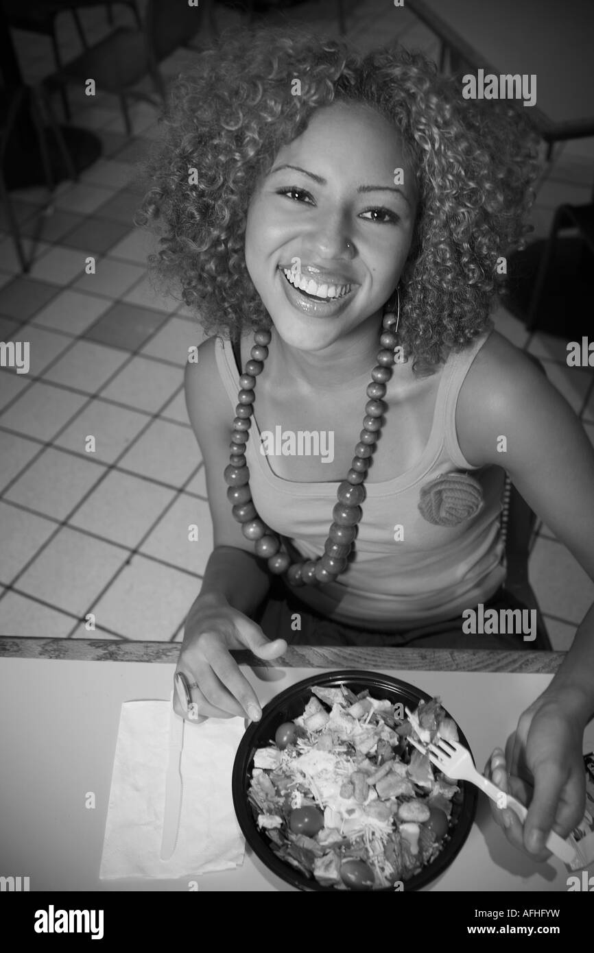 One woman eating Black and White Stock Photos & Images - Alamy
