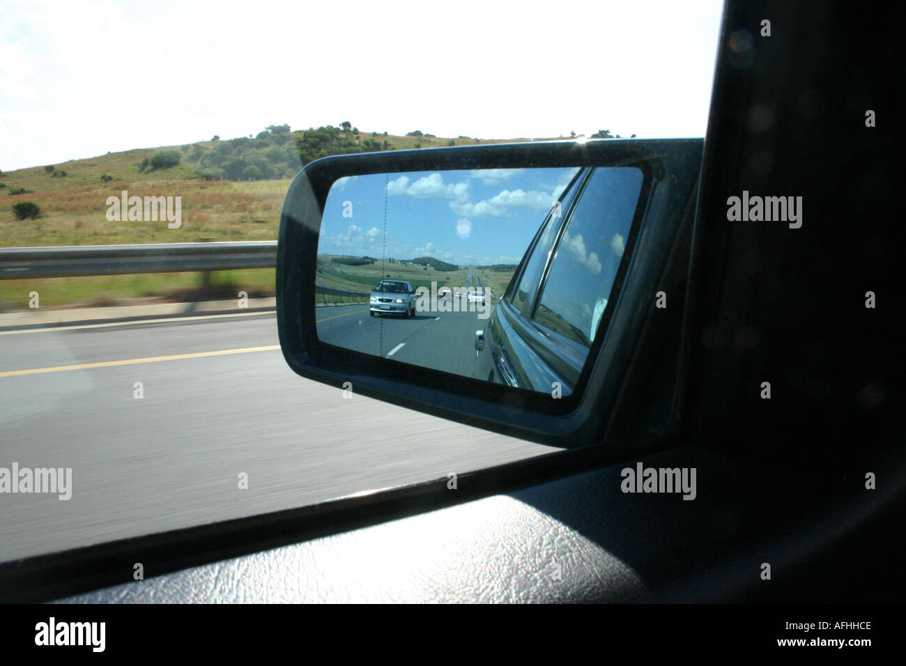 Reflection in car side mirror Stock Photo - Alamy