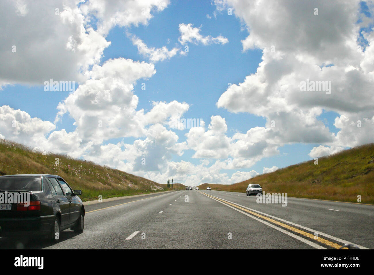 Cars travelling on open road Stock Photo - Alamy