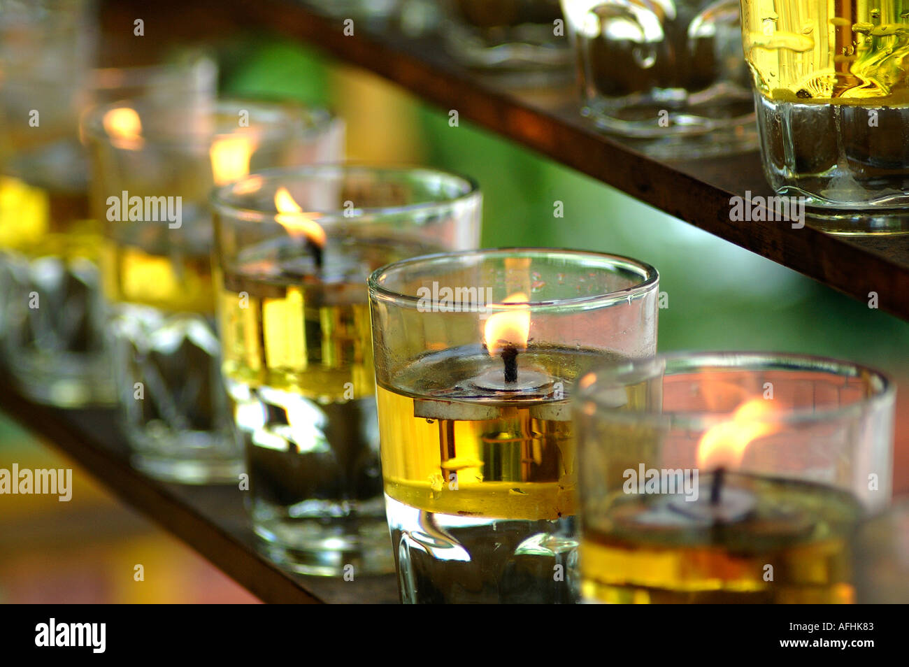 Row of Oil lamp at buddhist temple Stock Photo - Alamy