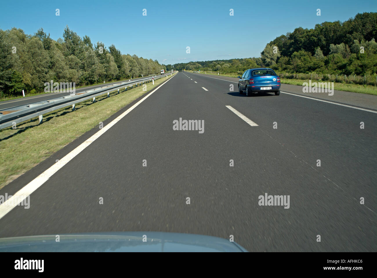 Car Driving on a Two Lane Toll Road Stock Photo - Alamy