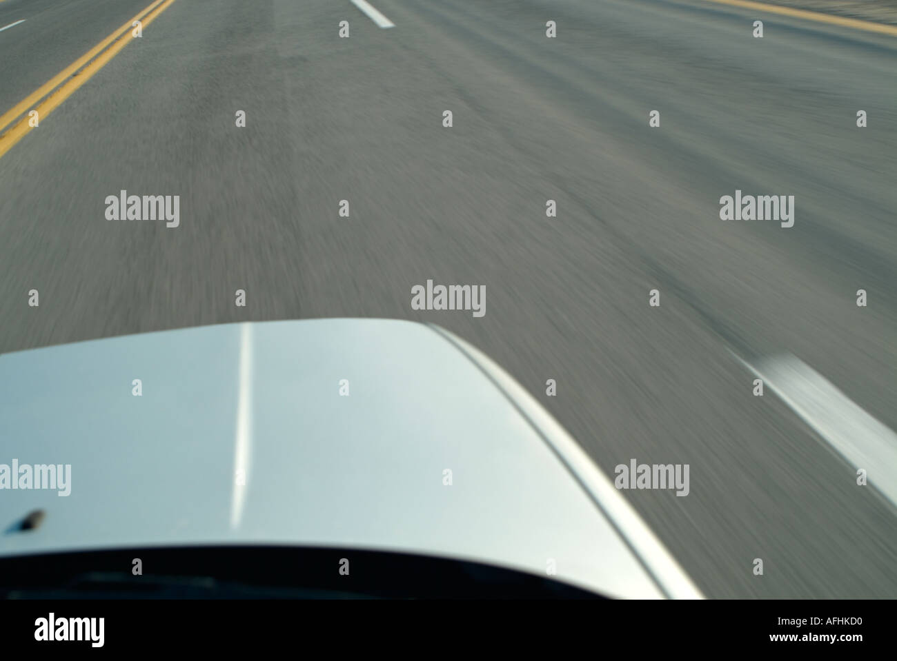 Car Driving at Speed Down a Motorway Slip Road, Low Angle Stock Photo ...