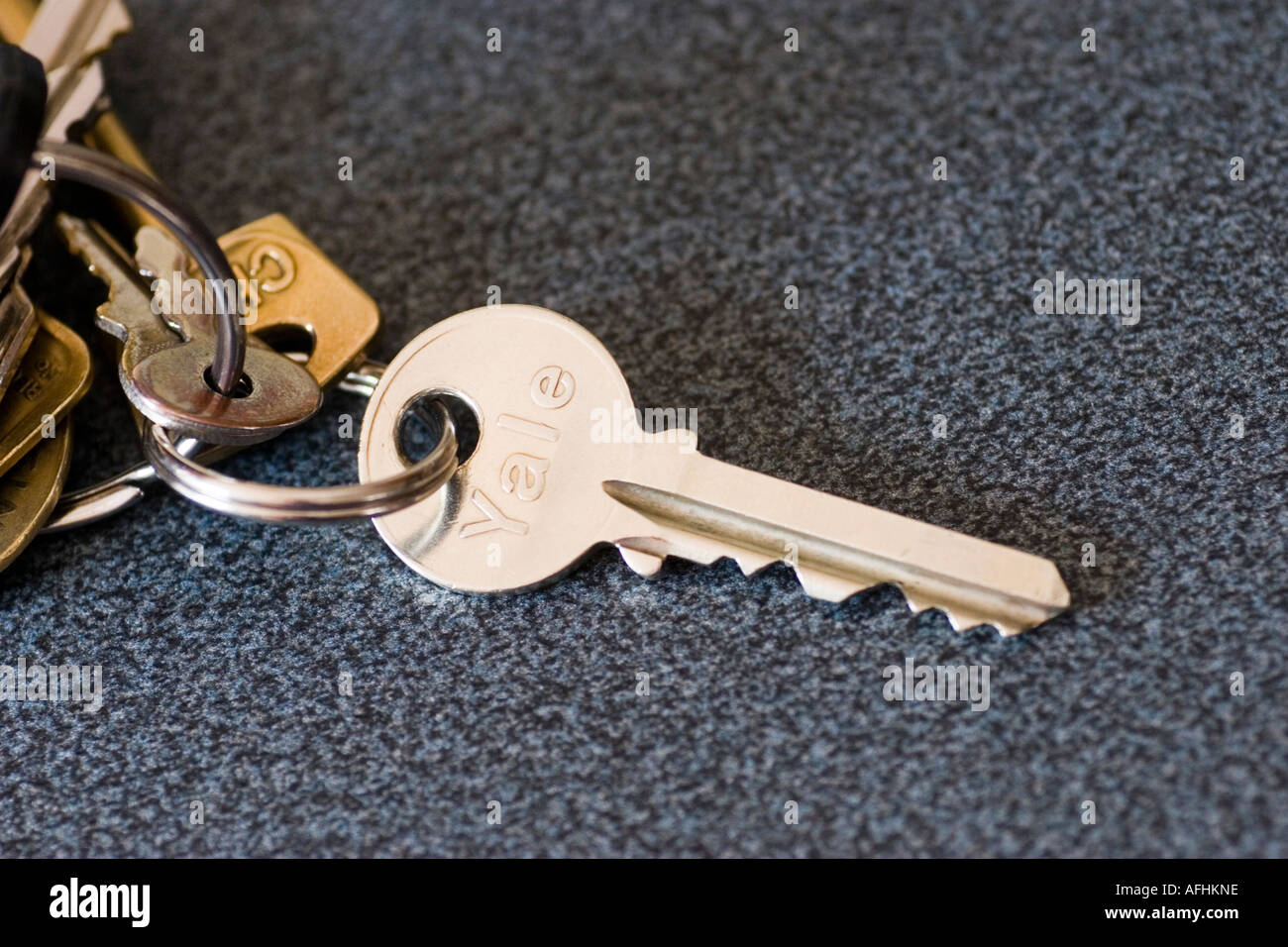 Yale house key on ring Stock Photo - Alamy