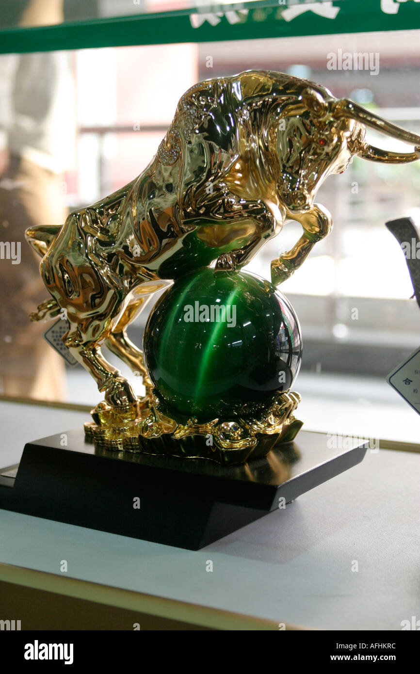 China Statue of a bull on sale with a vast number of other goods at the ...