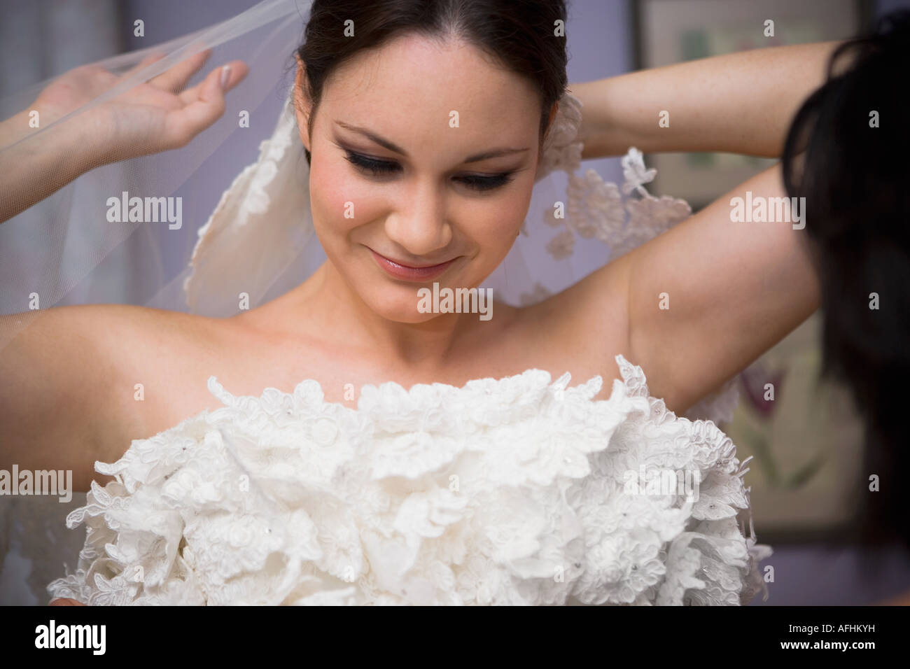 Bride getting ready with help from her mother Stock Photo - Alamy