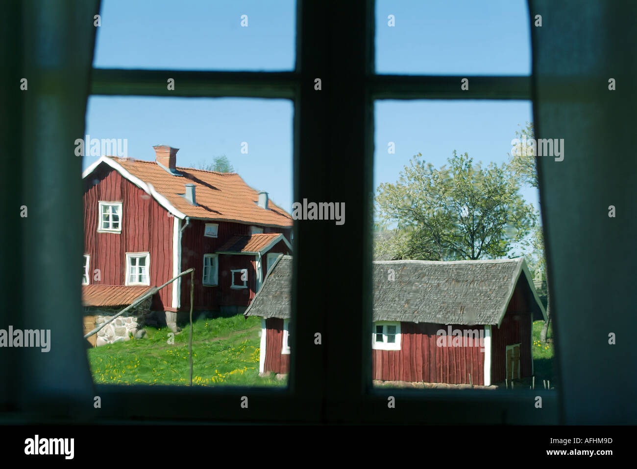 Window view against farmhouse Sweden Stock Photo - Alamy