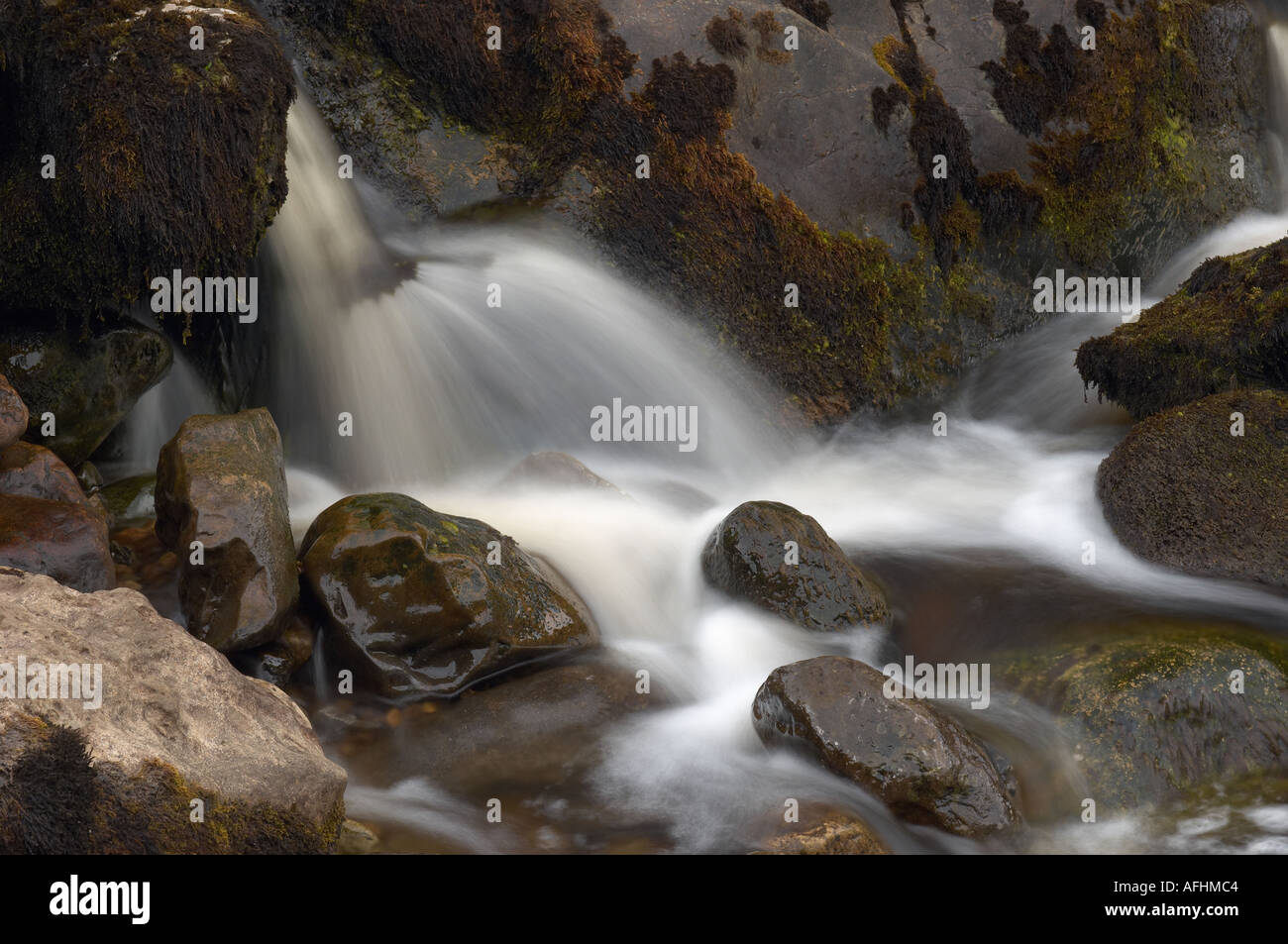 Water flowing over rocks Stock Photo - Alamy