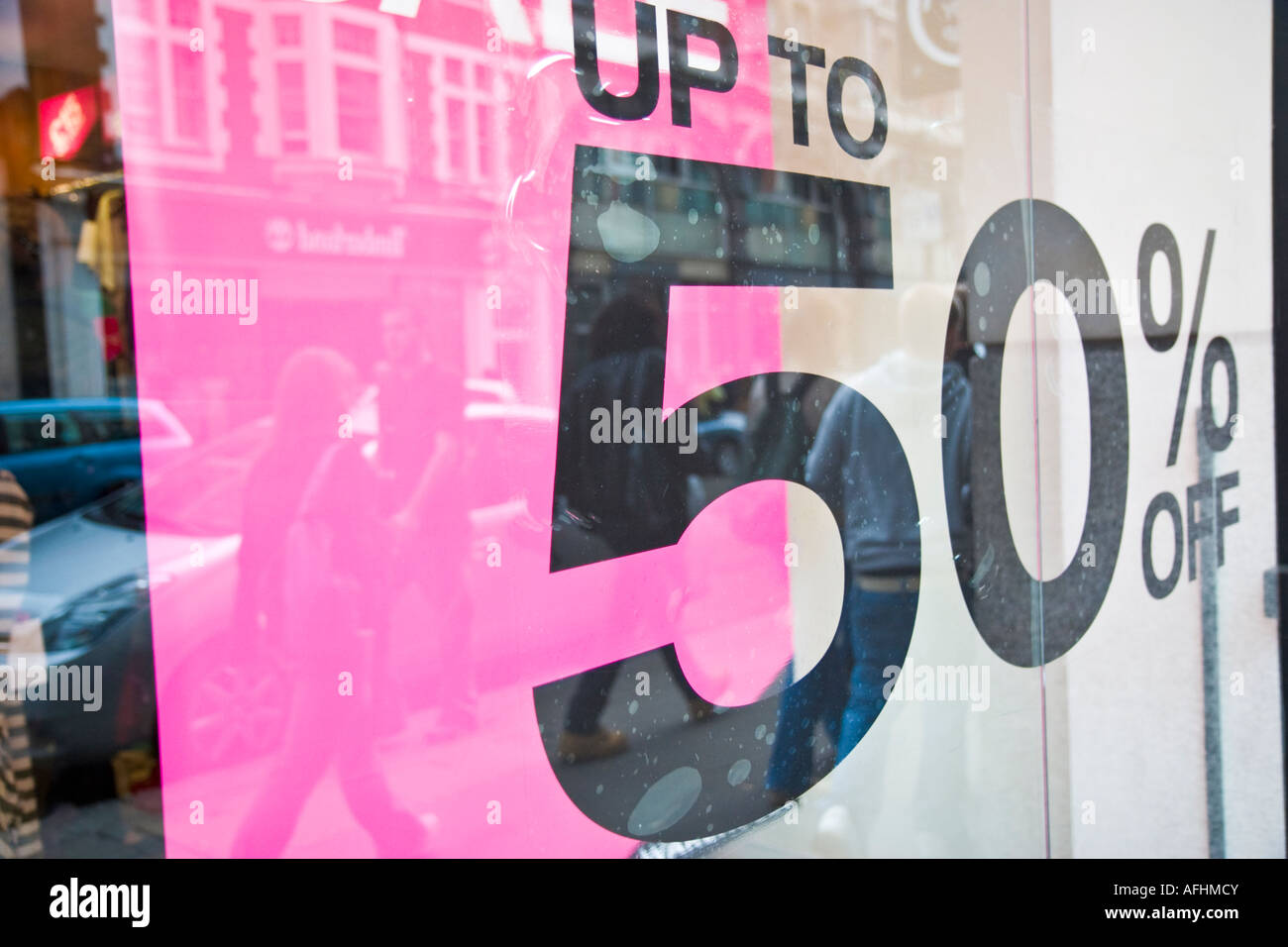 Fifty percent sale sign in store window Stock Photo - Alamy