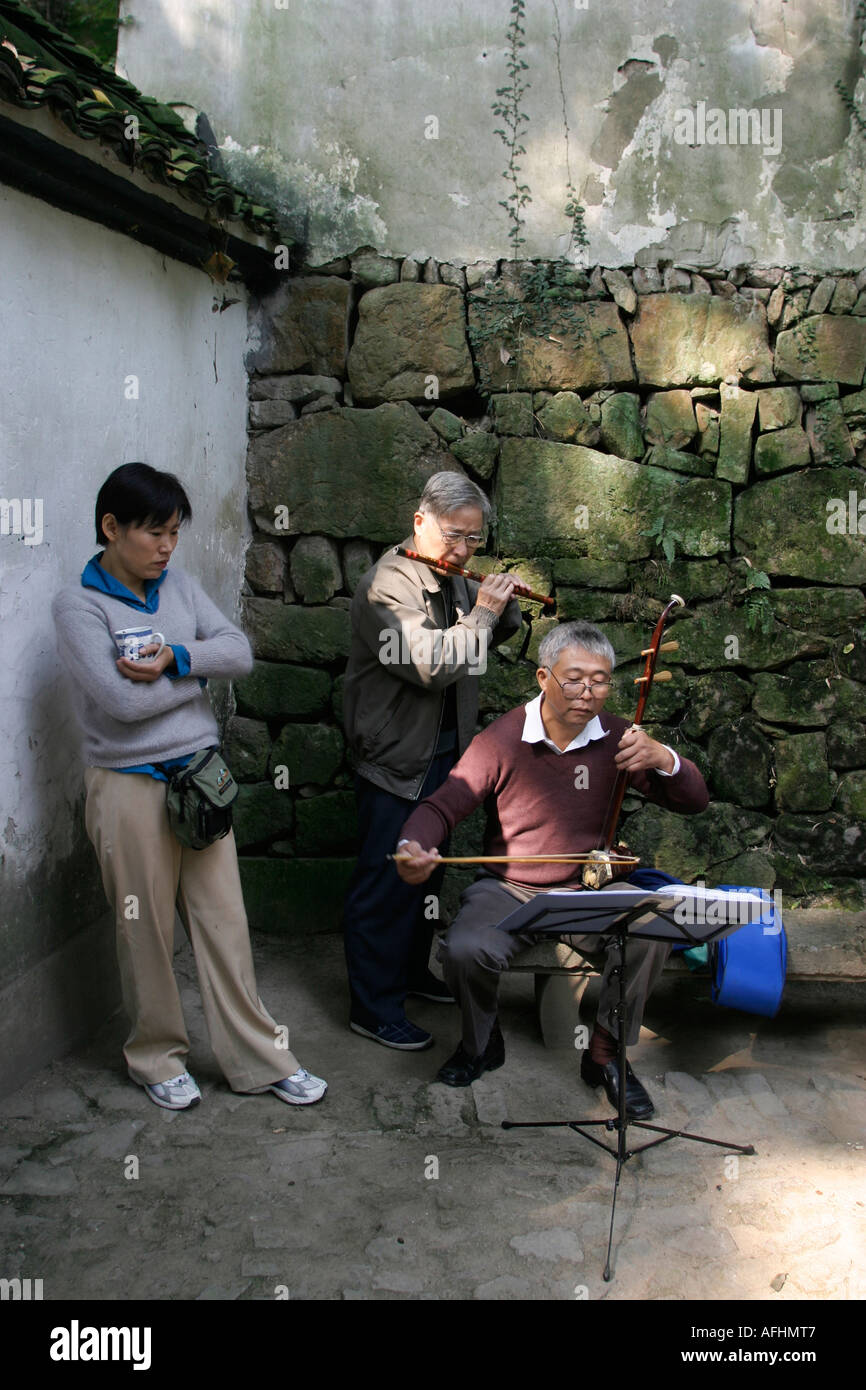 Women playing traditional instruments hi-res stock photography and ...