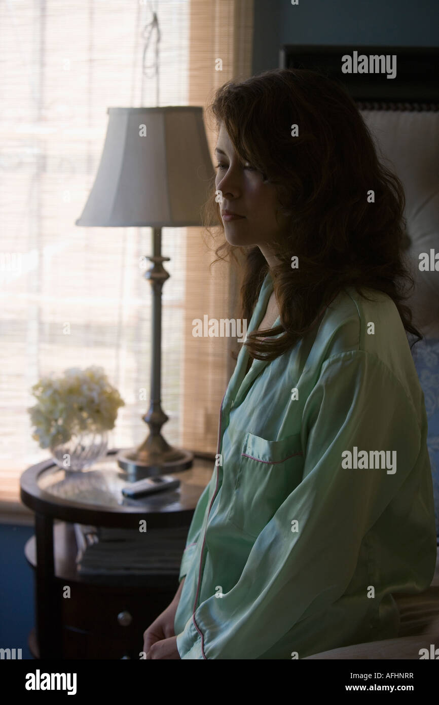 Old woman sitting on edge of bed hi-res stock photography and images ...