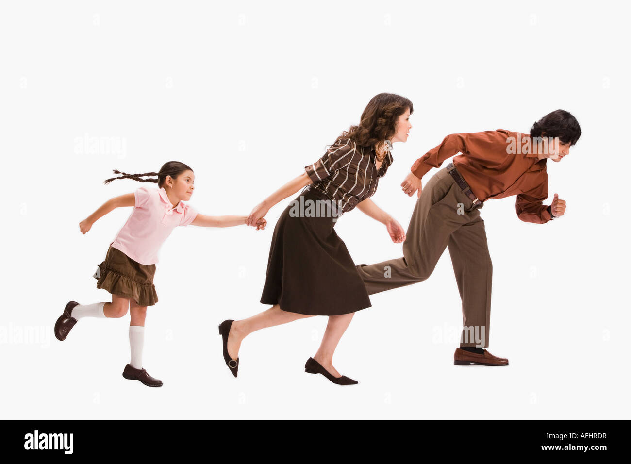 Studio portrait of family running Stock Photo - Alamy